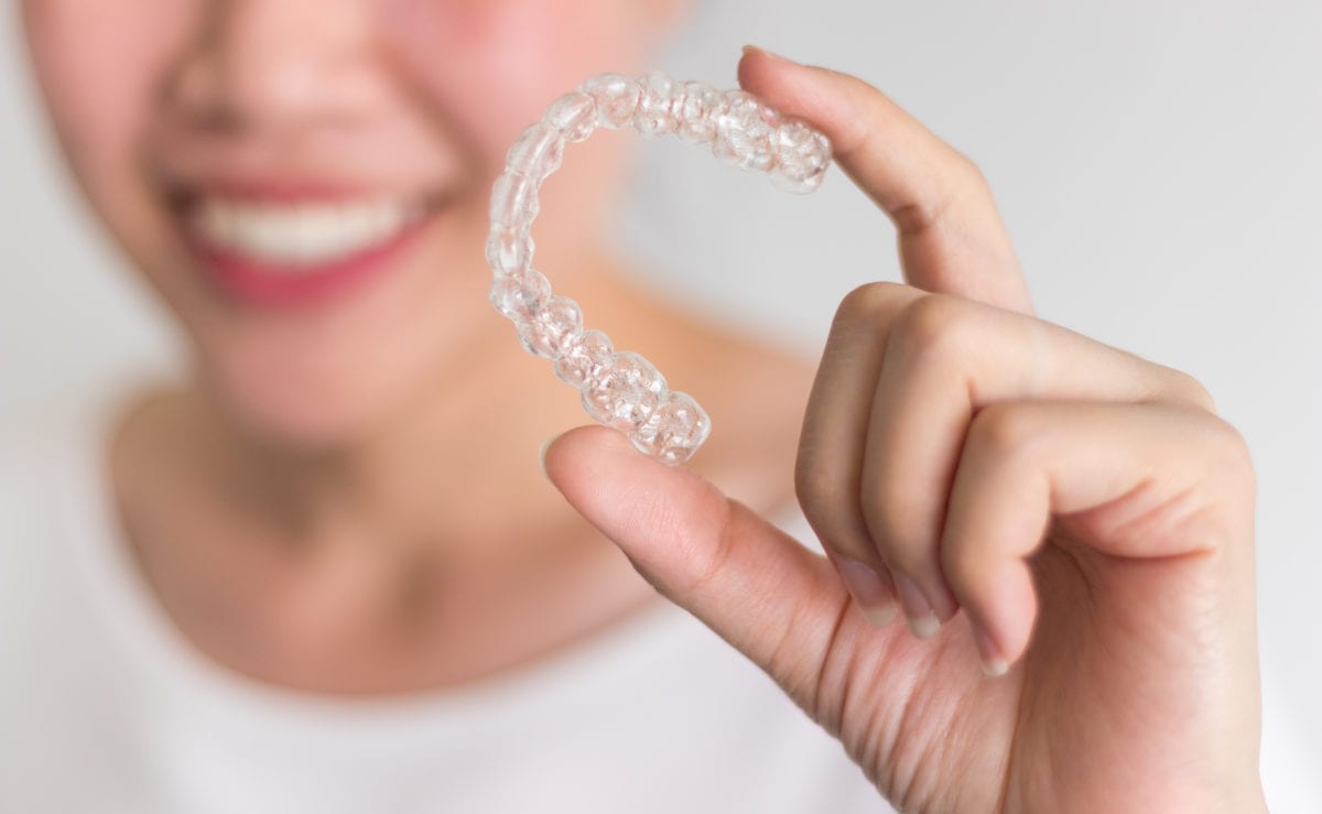 How Painful Is Invisalign? - Henry Orthodontics